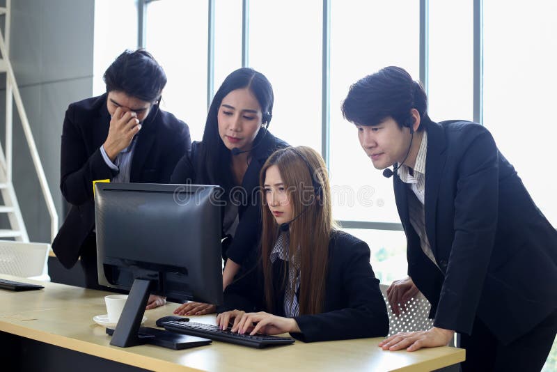 Asia Group of Call Center Workers or Confident Business Team with ...