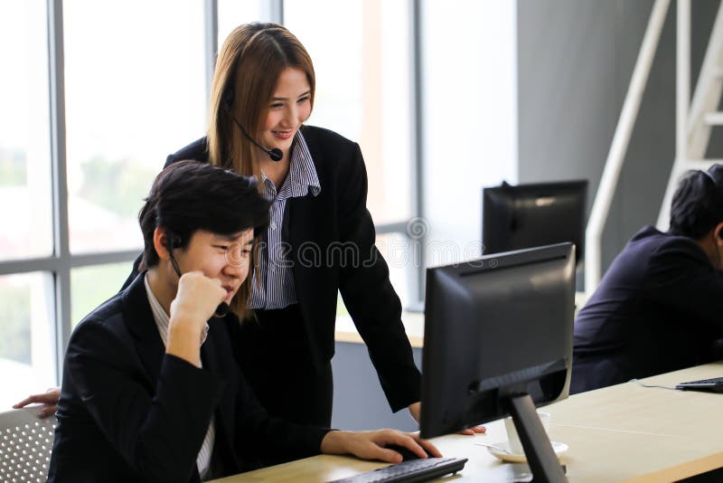 Asia Group of Call Center Workers or Confident Business Team with ...
