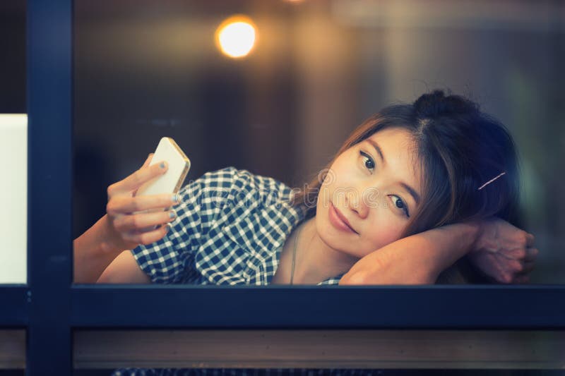 Asia Woman Sitting at Bar Table and Texting Her Mobile Stock Image ...