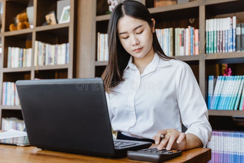 Asian Accountant Working and Analyzing Financial Reports Project ...