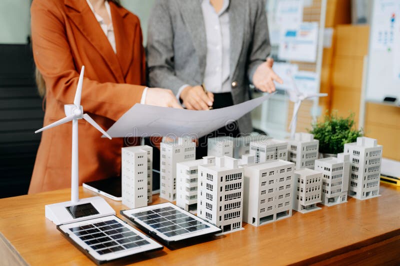 Asian Architects and Developers in a Modern Office Collaborate Using ...