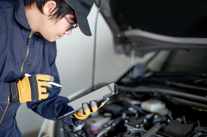 Asian Auto Mechanic Checking the Car Using Tablet Stock Image - Image ...