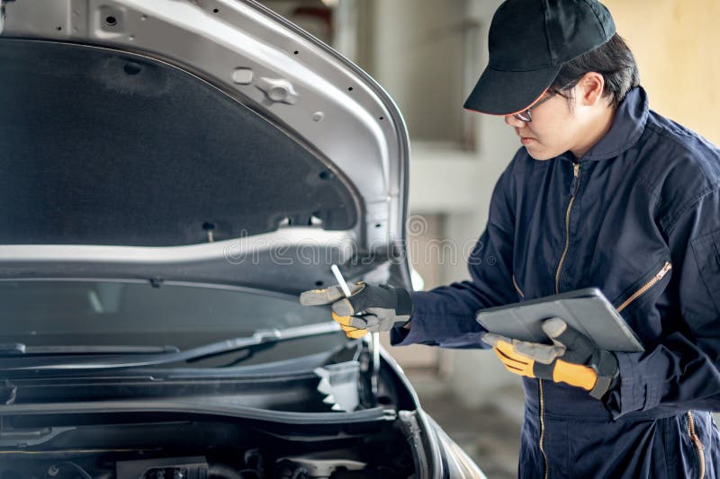 Asian Auto Mechanic Checking the Car Using Tablet Stock Image - Image ...