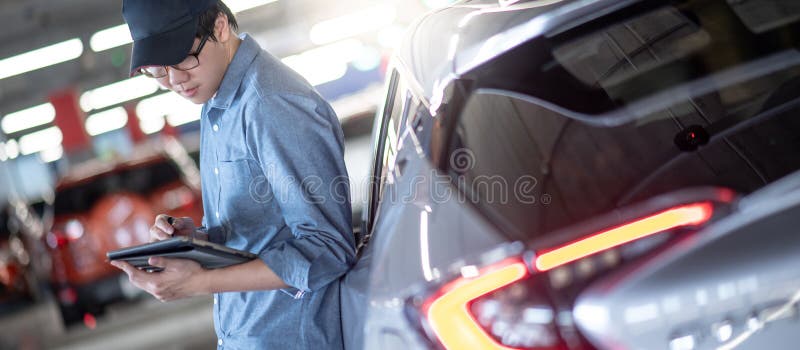 Asian Auto Mechanic Checking the Car Using Tablet Stock Image - Image ...