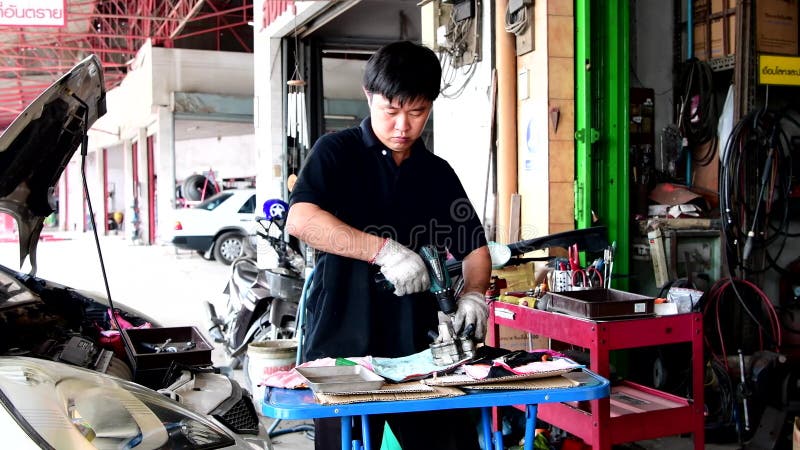 Thai Man Mechanic Installing Remodelled Car Engine on a Wooden Boat at ...