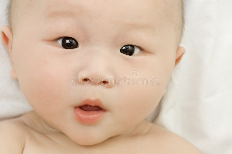 Chinese baby face smirking stock photo. Image of looking - 19376676