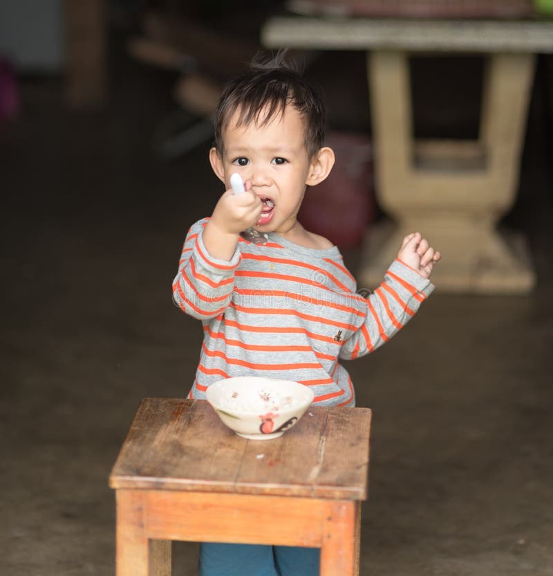 Asian Baby Boy Eating Fried Rice by Spoon by Him Self Stock Photo ...