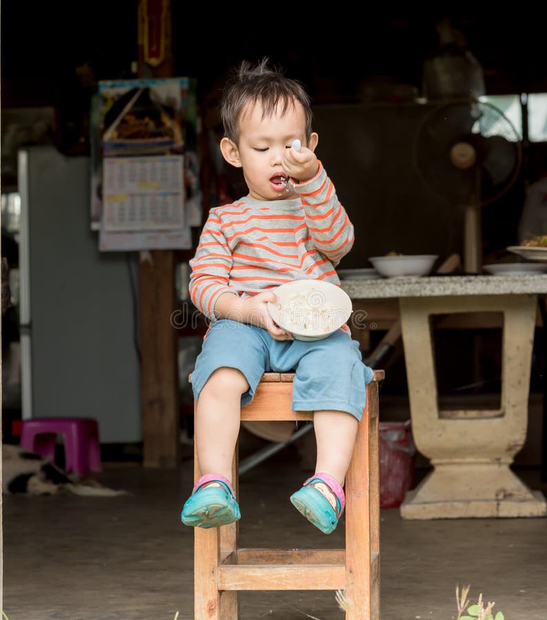 Asian Baby Boy Eating Fried Rice by Spoon by Him Self Stock Photo ...