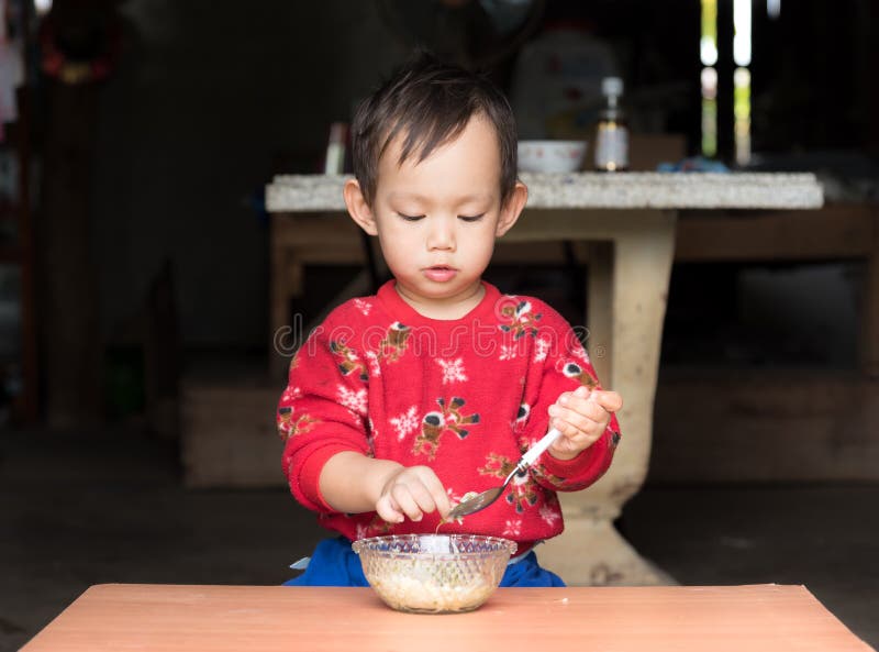 Asian Baby Boy Eating Fried Rice by Spoon by Him Self Stock Photo ...