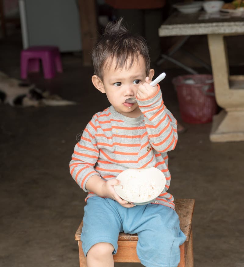Asian Baby Boy Eating Fried Rice by Spoon by Him Self Stock Photo ...