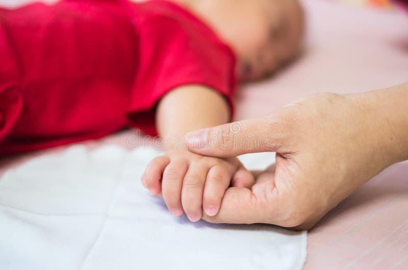 Asian Baby Hand on the Mothers Hand Stock Photo - Image of family ...