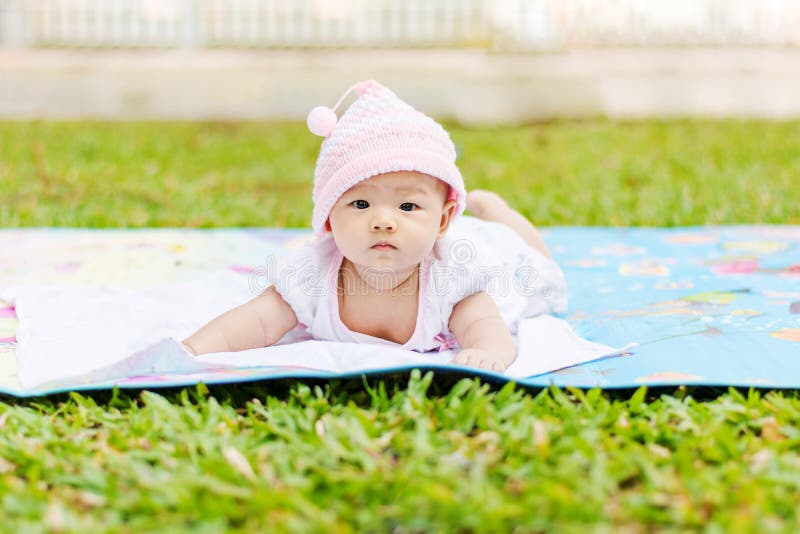 Asian Baby Lie Prone on Ground at Park Stock Photo - Image of care ...