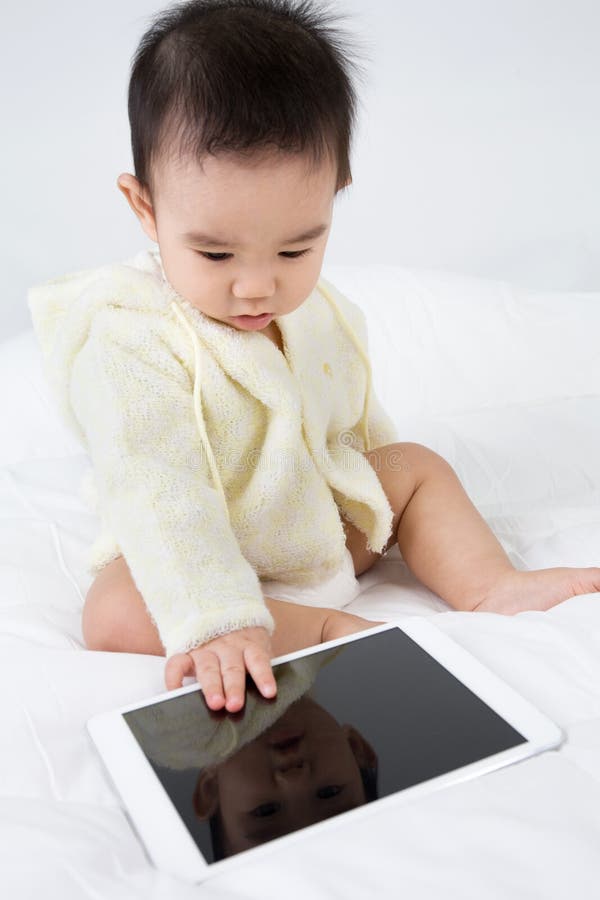 Asian Baby Play Game with Tablet PC Stock Photo - Image of internet ...
