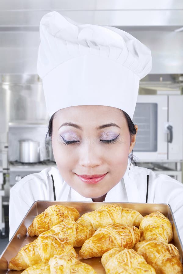 Asian baker smells bread stock photo. Image of preparation - 29877440