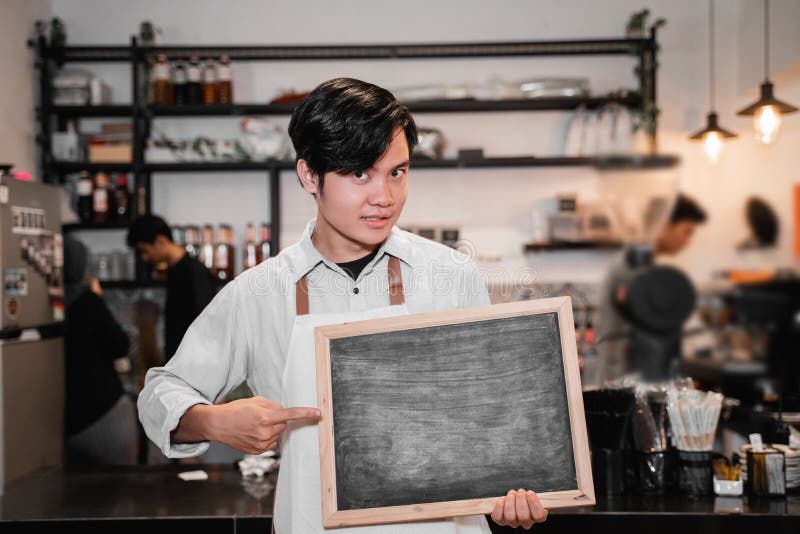 Asian Barista Holding and Pointing a Board Stock Photo - Image of ...