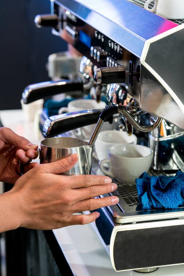 Asian Barista Steaming Fresh Milk in Stainless Pitcher with Vent Stock ...
