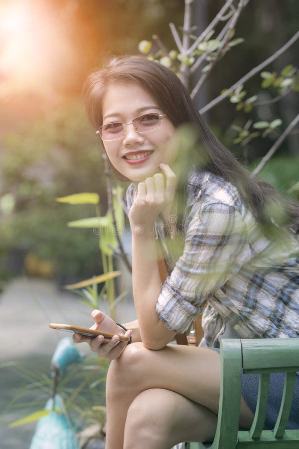 Asian Beautiful Younger Woman Toothy Smiling Face and Relaxing in ... Asian Beautiful Younger Woman Toothy Smiling Face and Relaxing in ...