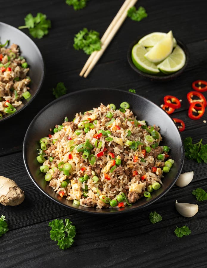 Asian Beef Fried Rice with Eggs and Vegetables in Black Bowl Stock ...