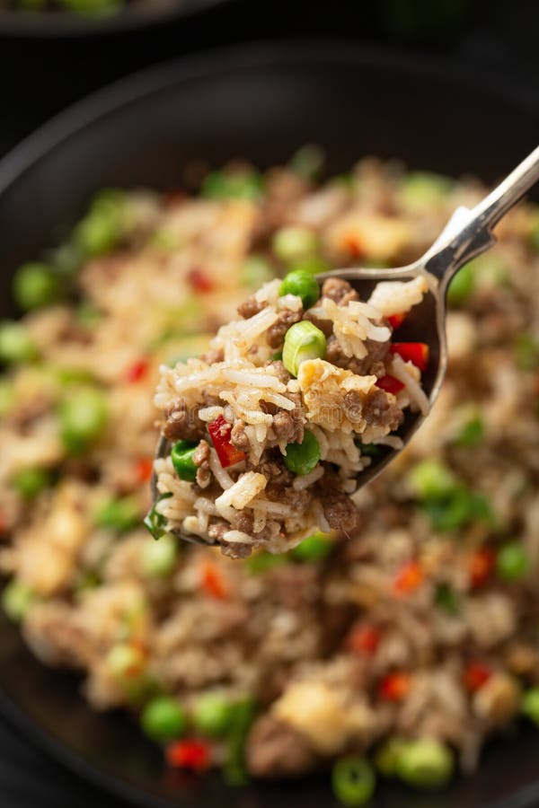 Asian Beef Fried Rice with Eggs and Vegetables in Black Bowl Stock ...
