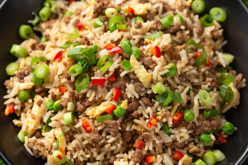 Asian Beef Fried Rice with Eggs and Vegetables in Black Bowl Stock ...