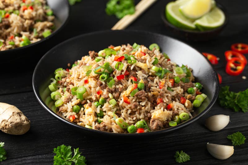 Asian Beef Fried Rice with Eggs and Vegetables in Black Bowl Stock ...