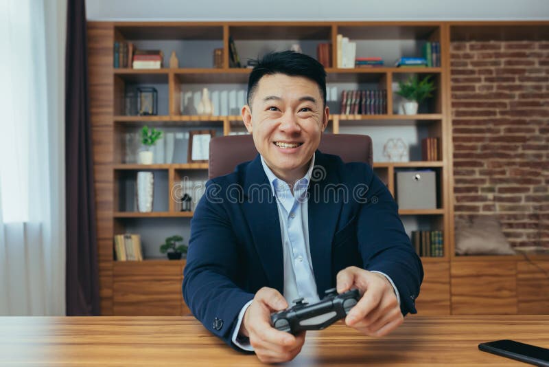 Boss Playing Computer Games in the Workplace, Businessman in Working in ...