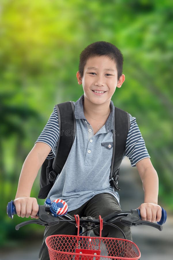 Asian Schoolboy Backpack Riding Bike Stock Photos - Free & Royalty-Free ...