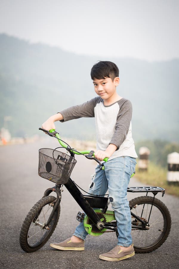 Asian Boy Riding His Bycicle Road Stock Photos - Free & Royalty-Free ...