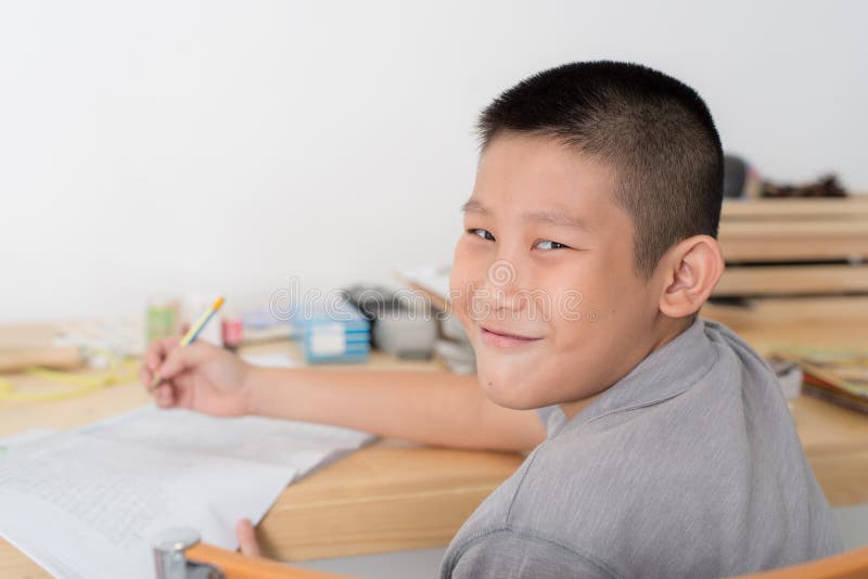 Asian Boy Doing Homework at Home Stock Photo - Image of active, blank ...