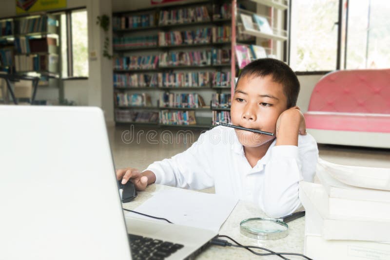Asian boy doing homework . stock image. Image of enjoy - 121623011