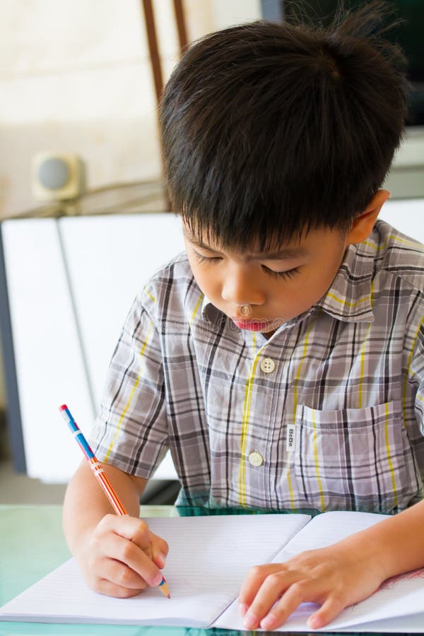 Asian boy doing homework stock image. Image of thai, childhood - 32562229