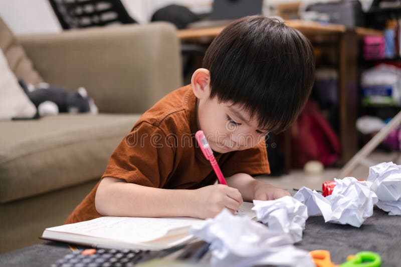 Asian Boy Drawing on Table and There Was a Piece of Paper Left on the ...