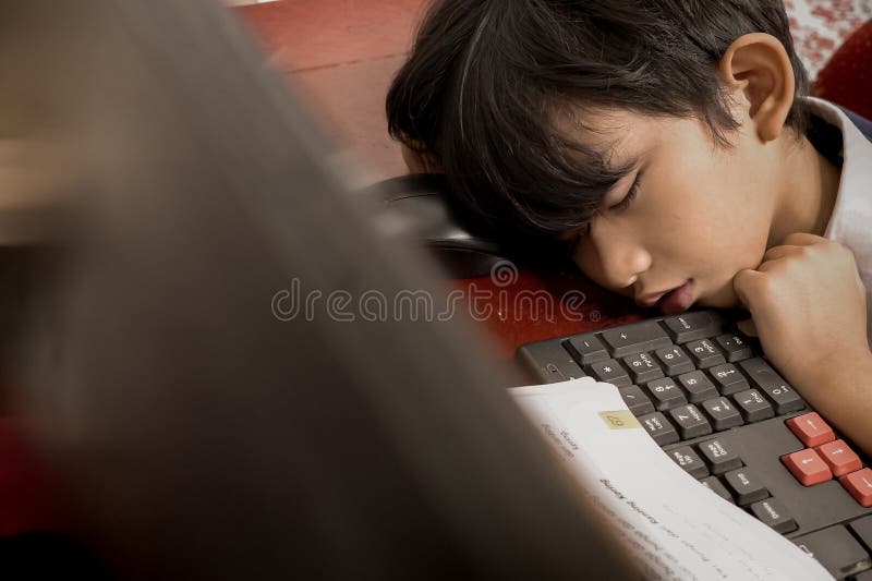 Asian Boy Fallen Asleep in Front of His Computer Stock Photo - Image of ...
