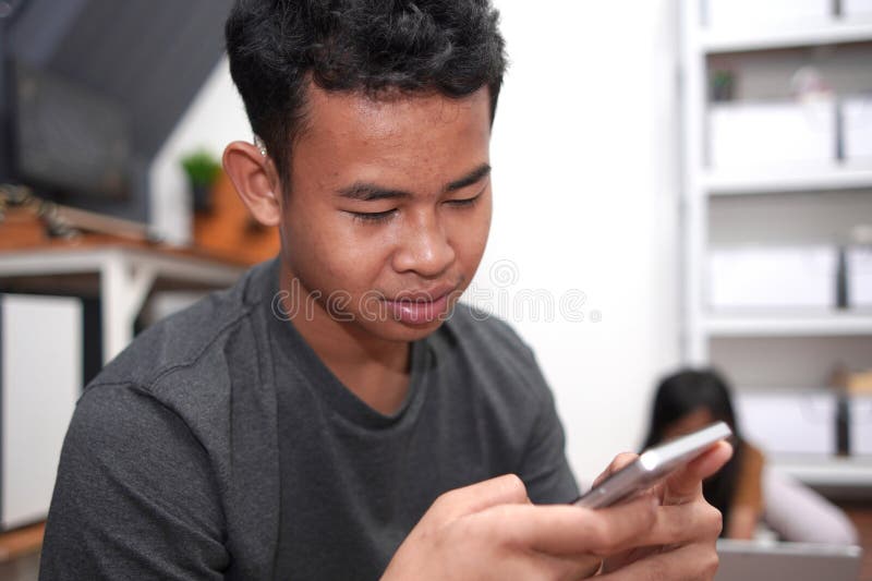Asian Boy with Hearing Aid Device Using Phone Stock Image - Image of ...