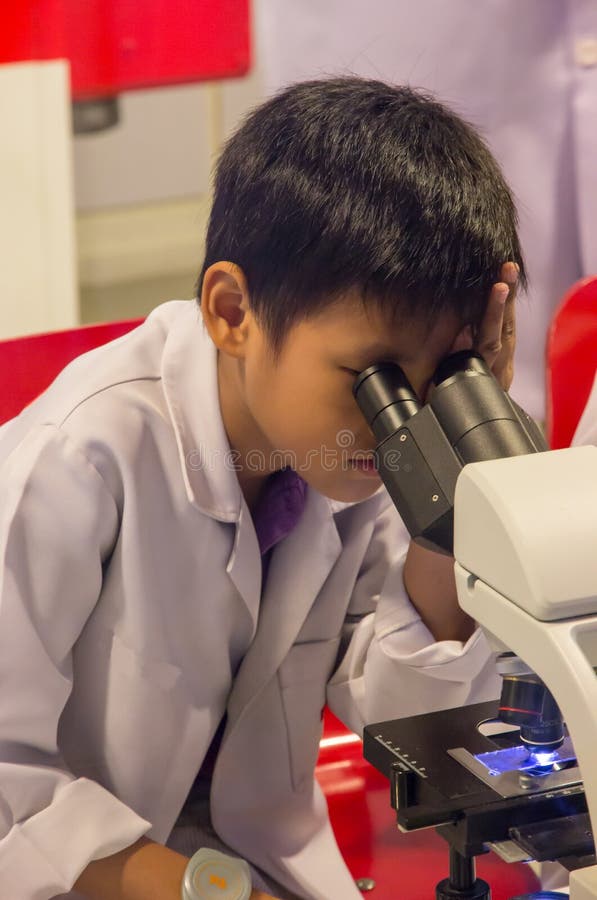 Asian Boy Looking through Microscope Stock Photo - Image of childhood ...