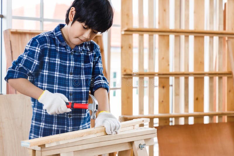 Boy nails timber wood. stock image. Image of learn, lifestyle - 203545733