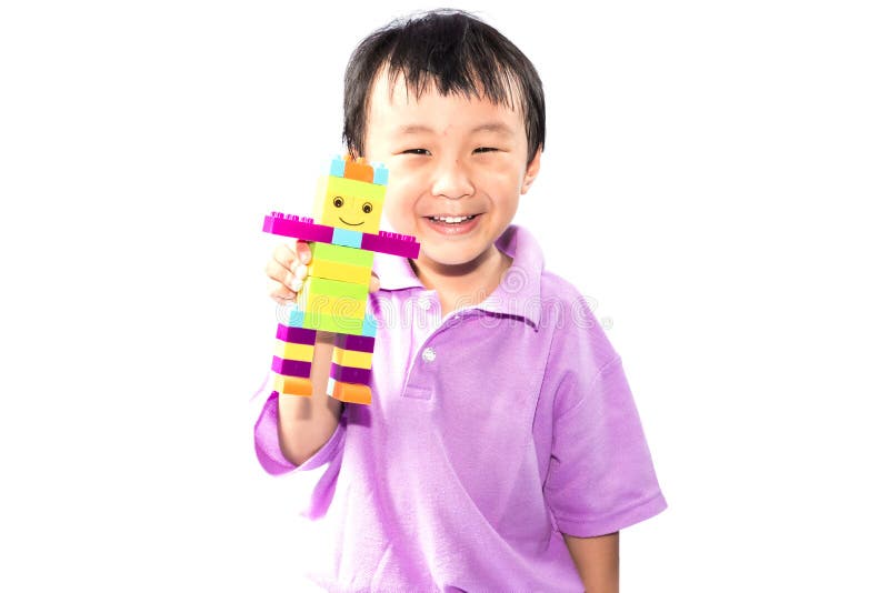Asian boy playing Lego stock image. Image of isolate - 56627727