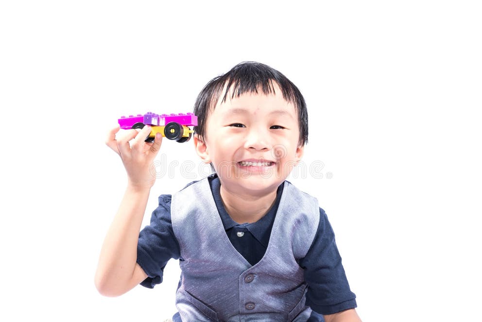 Asian boy playing Lego stock photo. Image of activity - 56627808