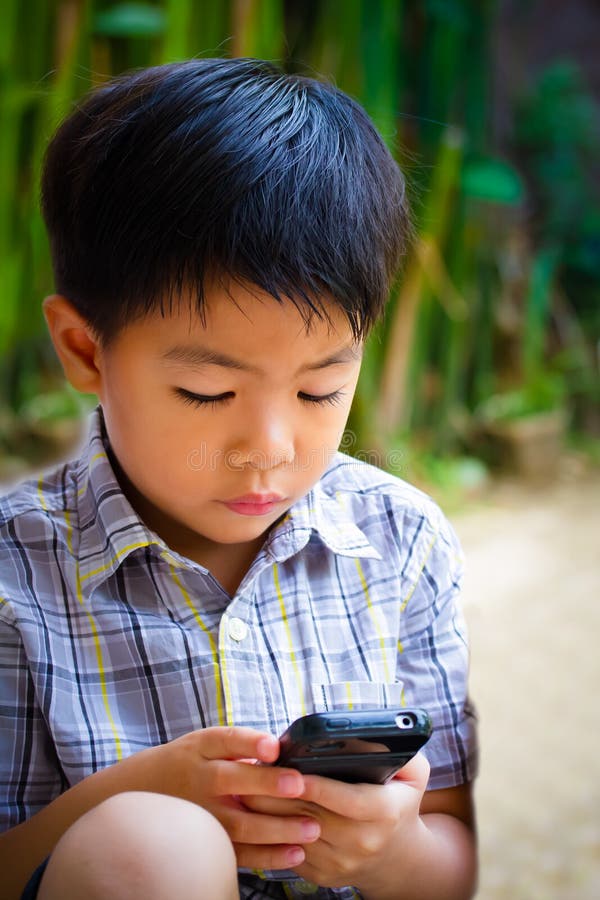 Happy Asian Boy Playing IPad Stock Image - Image of ipad, happy: 20405233