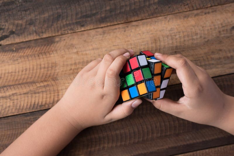 Asian Boy Playing with Rubik`s Cube.boy Solving Puzzle Editorial ...