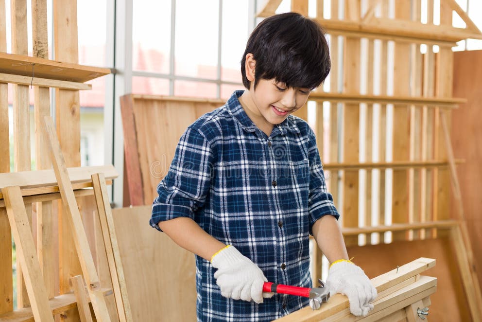 Asian Boy Practicing Carpentry Work by Himself Stock Photo - Image of ...