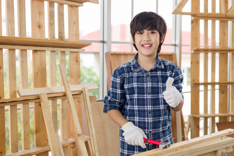 Asian Boy Practicing Carpentry Work by Himself Stock Photo - Image of ...
