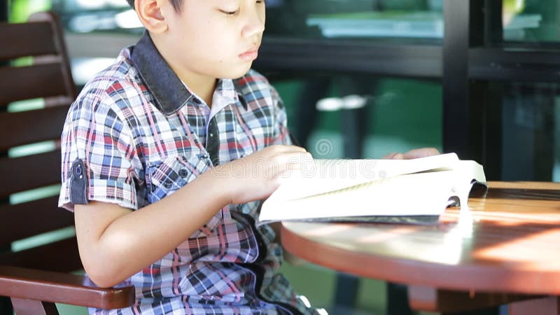 Asian Boy Reading Book in Library Stock Photo - Image of childhood ...