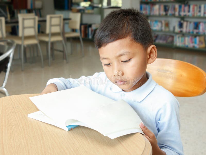 Asian boy doing homework . stock image. Image of classroom - 121622751