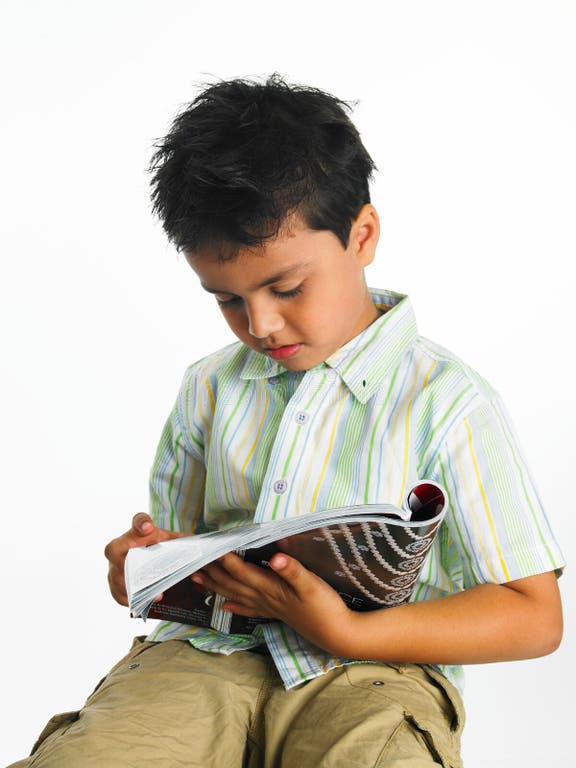 Asian Boy Reading a Magazine Stock Photo - Image of open, holding: 6341312