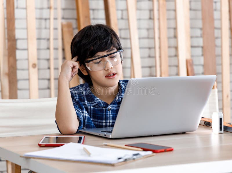 Boy Thinking while Using Laptop Computer. Stock Photo - Image of look ...