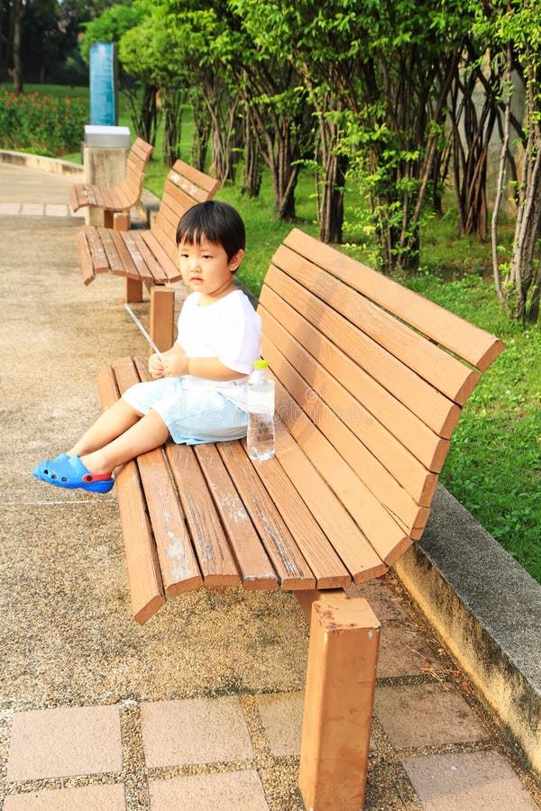Asian Boy Sitting on the Bench Stock Image - Image of human, childcare ...