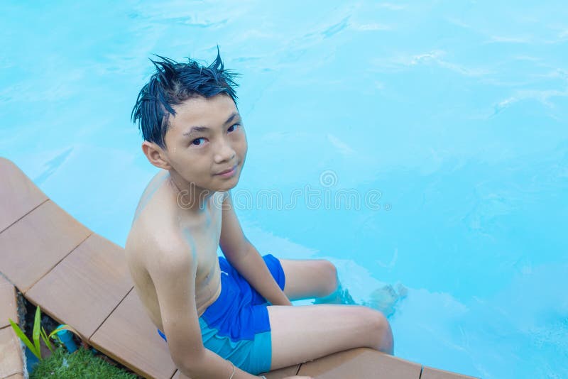 Asian Boy Sitting at the Edge of the Pool Stock Image - Image of ...