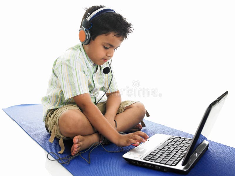 Asian Boy Typing into His Laptop Stock Photo - Image of indian, headset ...