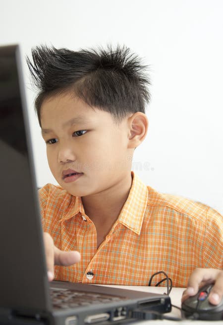 Asian boy using computer stock image. Image of child - 23423409